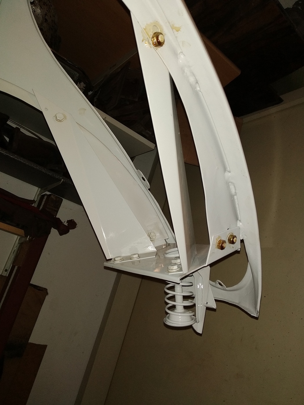 Bonnet catch and release mechanism with the air deflectors